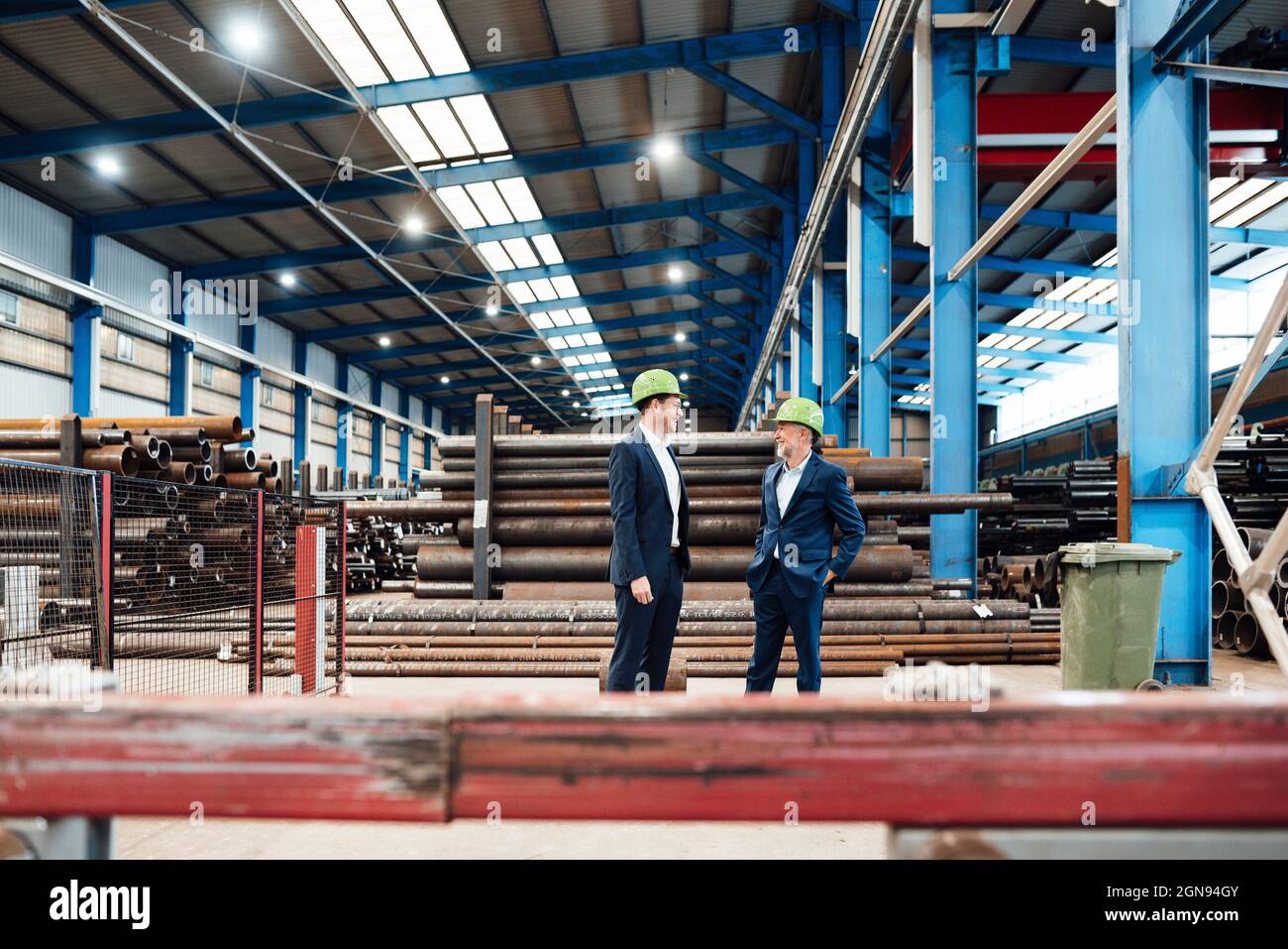 Male professionals standing together on staircase Stock Photo - Alamy