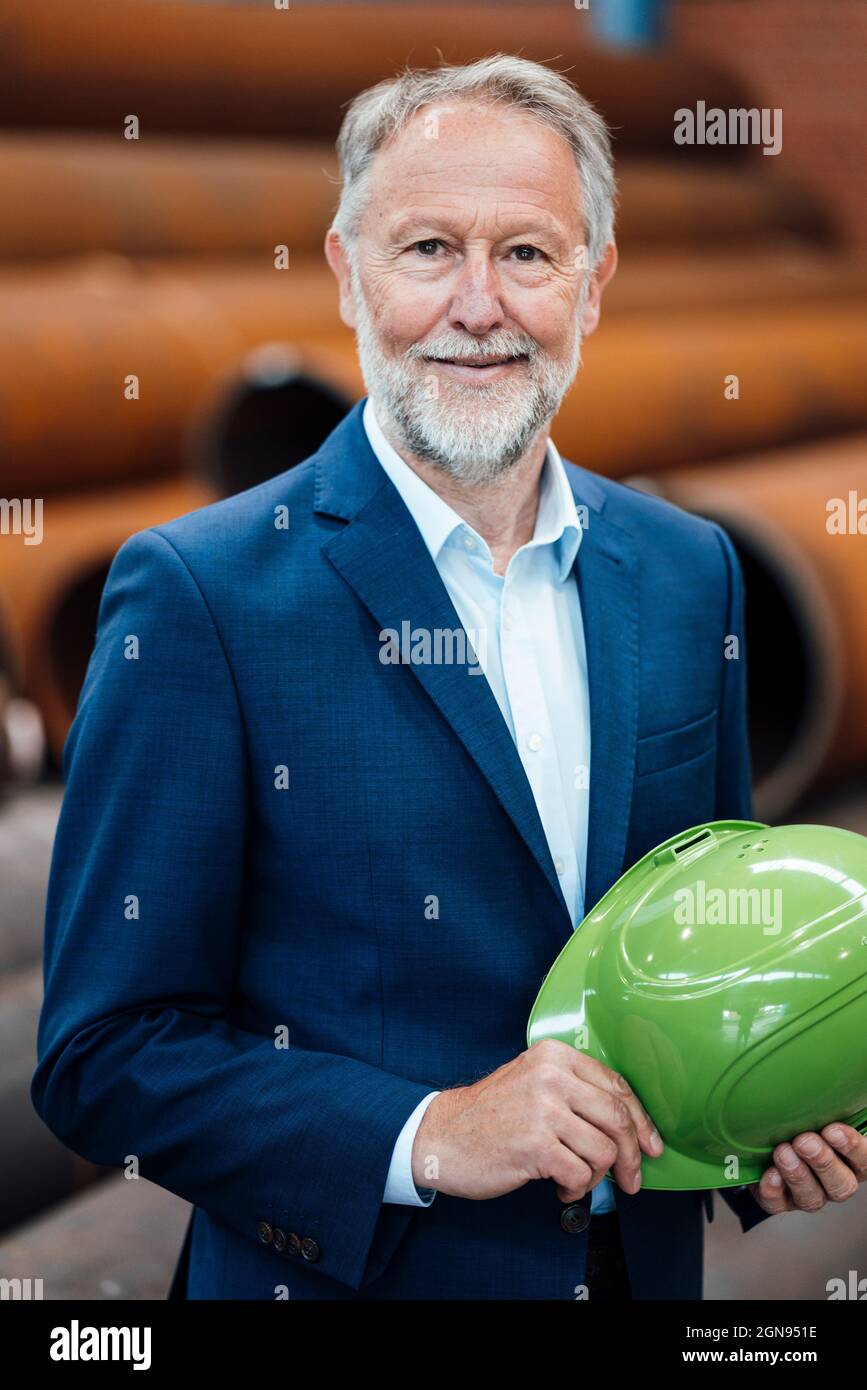 Male business professional with gray hair in industry Stock Photo - Alamy