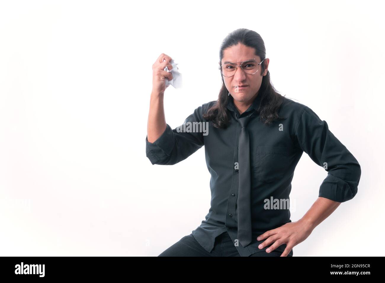 Man on white background. He crumples a leaf between his hand in anger ...