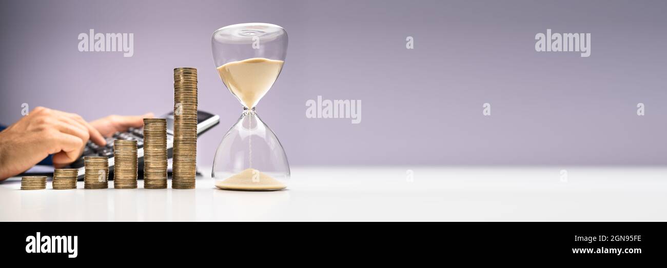 Increasing Money Coin Stack Concept. Hourglass And Time Stock Photo - Alamy