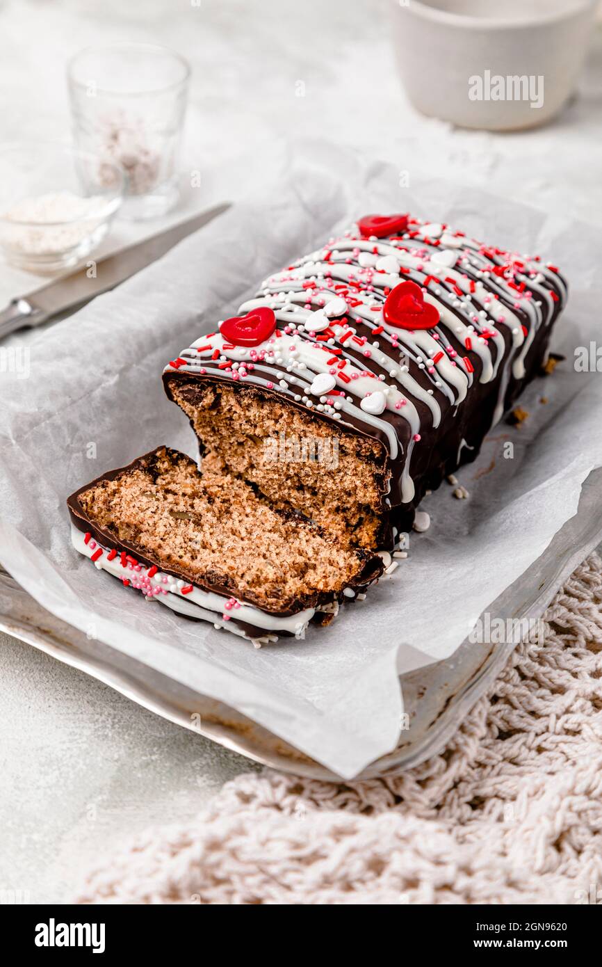 Plate with heart shaped cookie cake missing single bite Stock Photo - Alamy