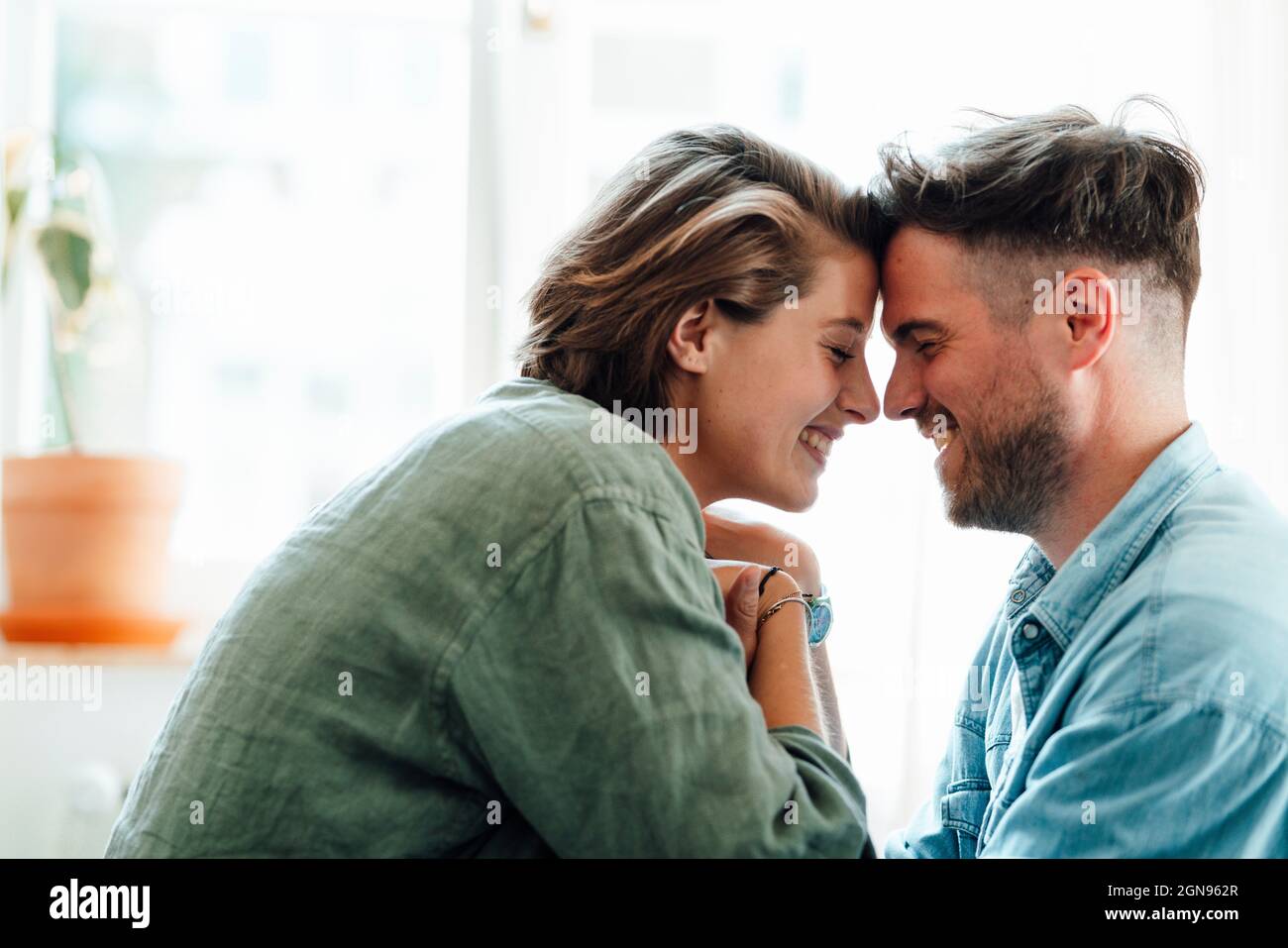 Two men foreheads touching hi-res stock photography and images - Alamy