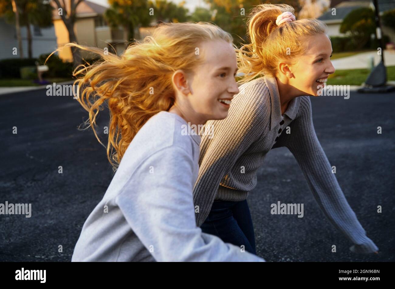 Two girls running away hi-res stock photography and images - Alamy