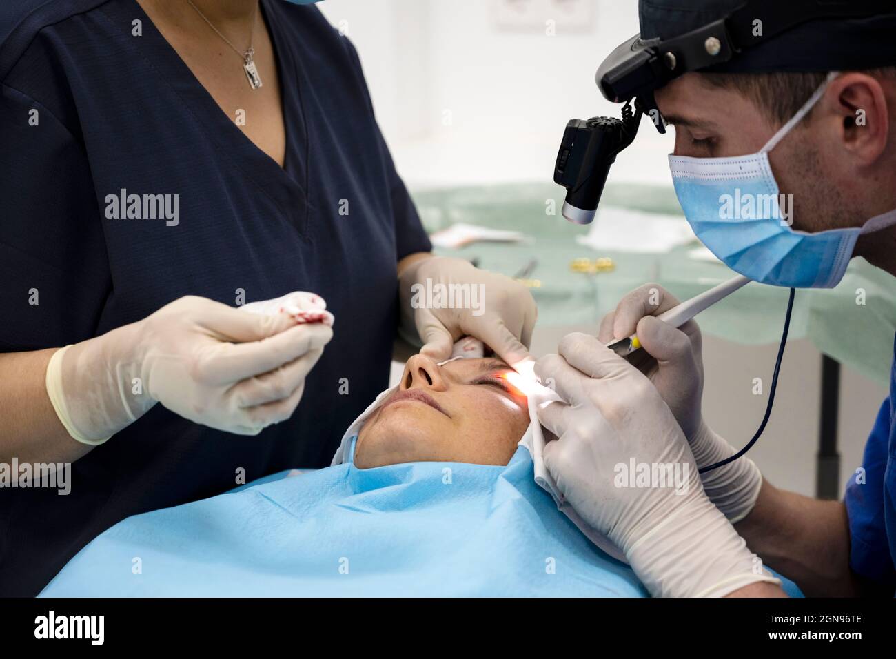 Plastic surgery operation, modifying the eye region in medical clinic ...