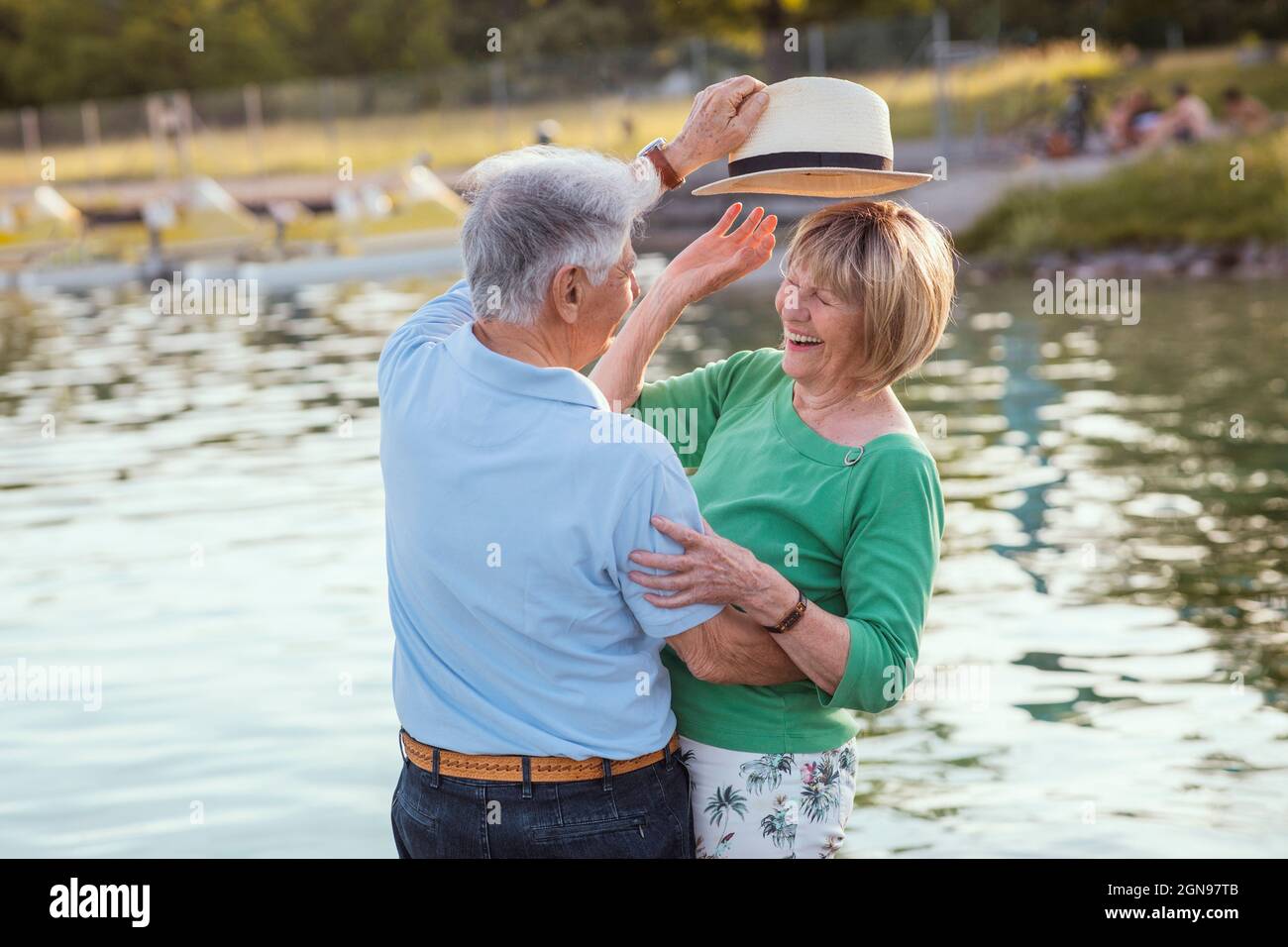 Putting on hat hi-res stock photography and images - Alamy