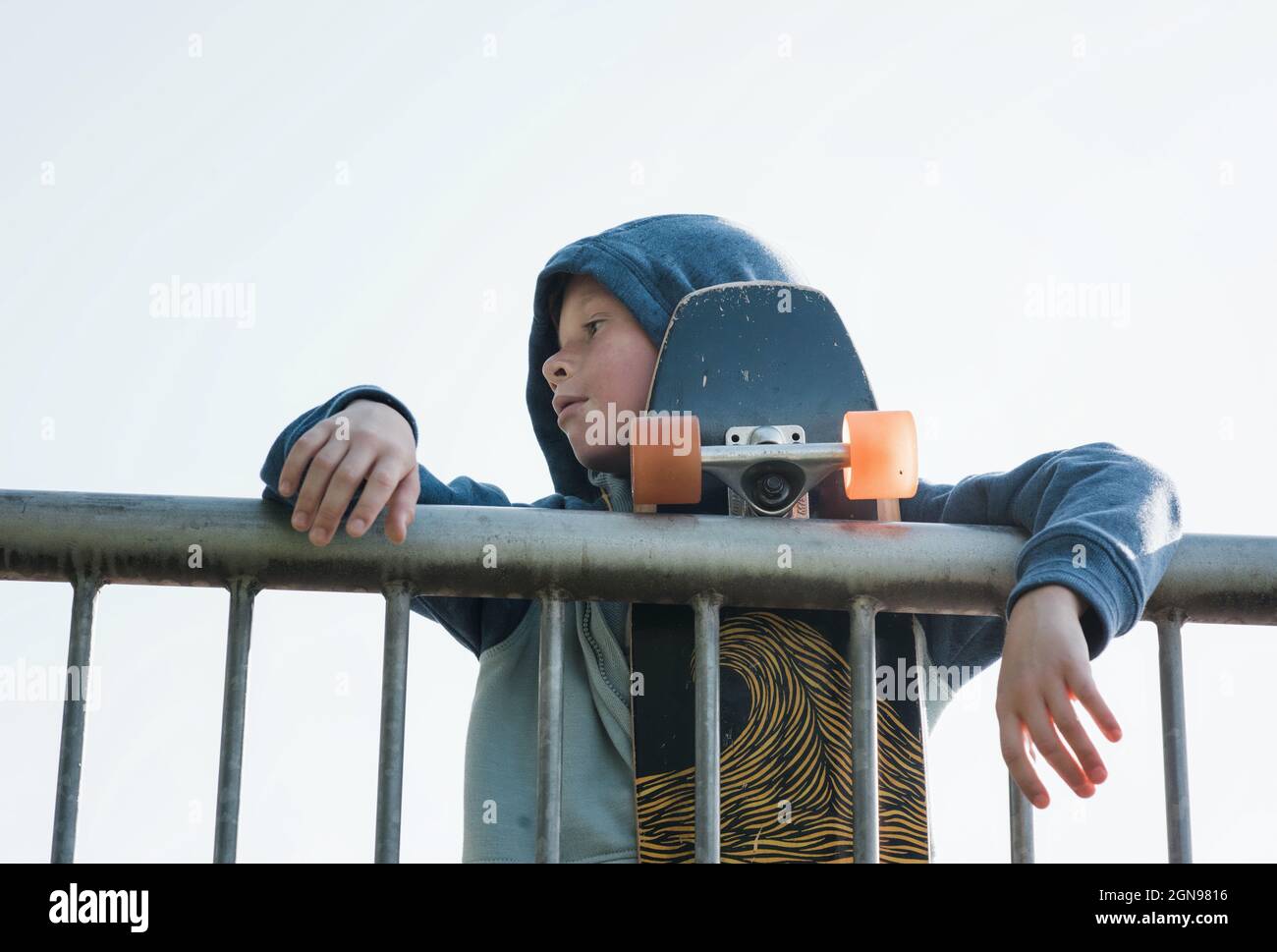 boy looking exhausted from skating at a skate park Stock Photo - Alamy