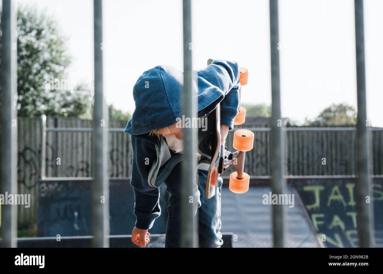 boy skateboarding in summer at a skate park in the UK Stock Photo - Alamy