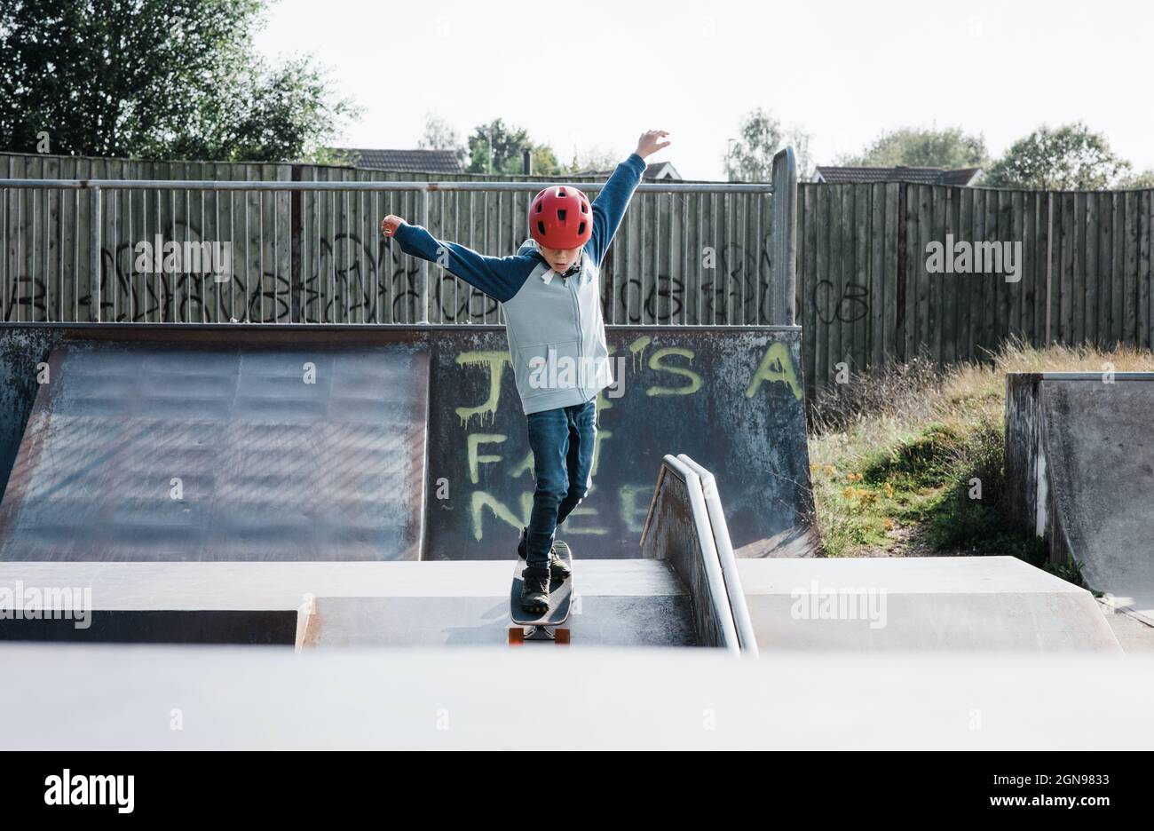 boy skateboarding at a skate park having fun in the UK Stock Photo - Alamy