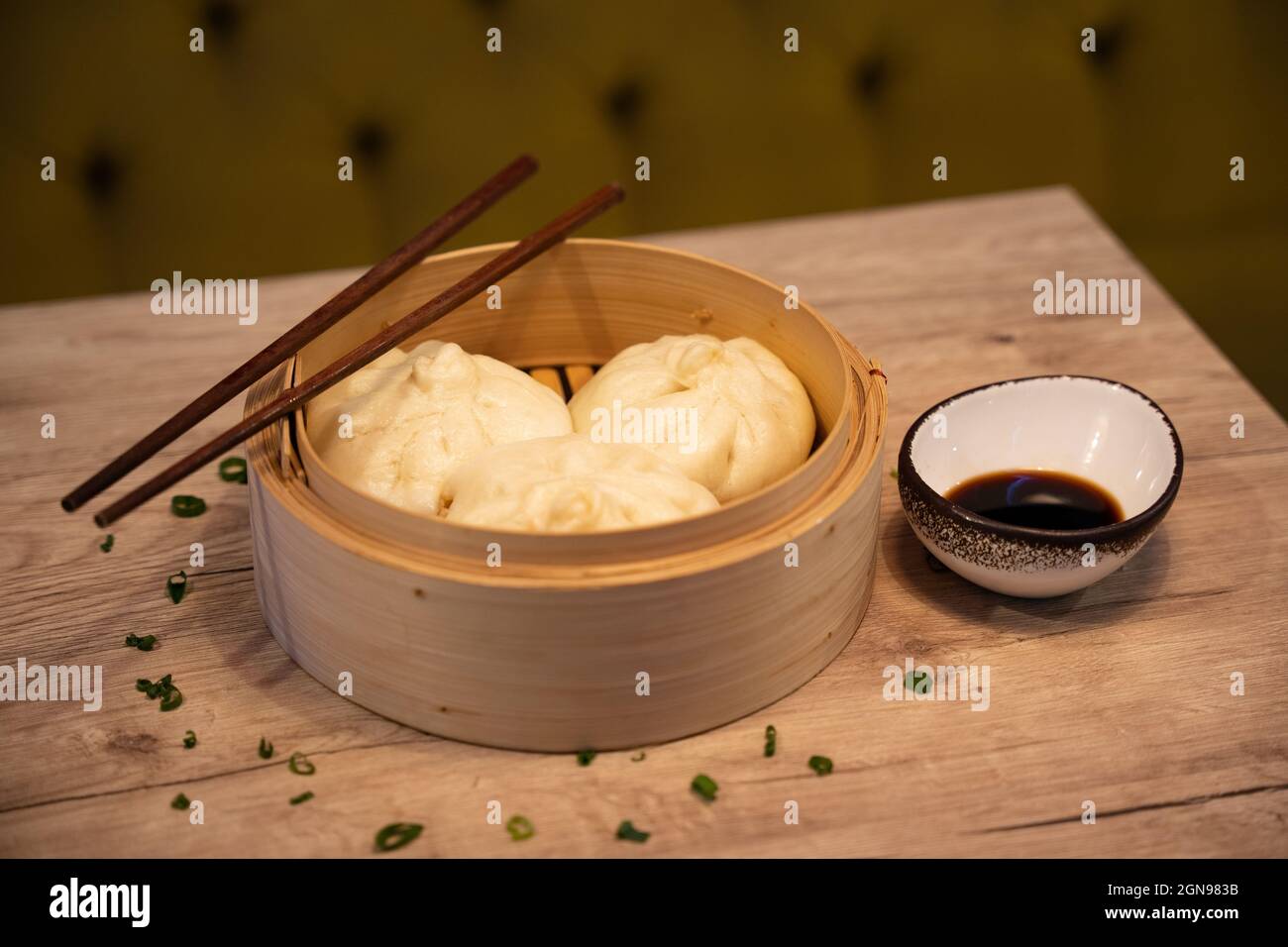 Traditional Chinese Baozi dumplings served with soy sauce Stock Photo ...