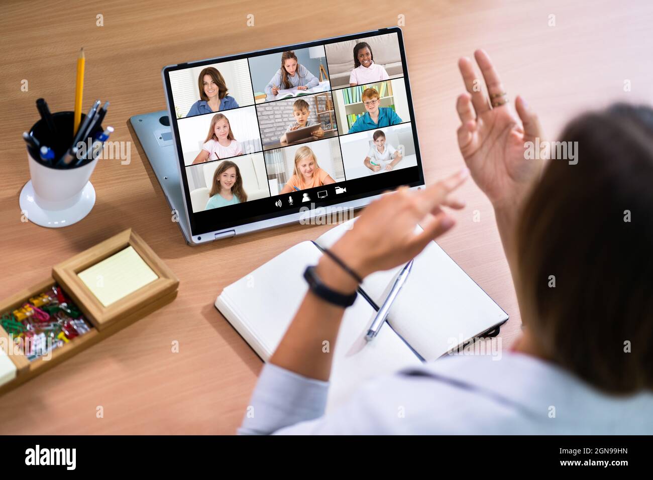 Teacher Hosting Online Class Using Video Conference On Laptop Stock ...
