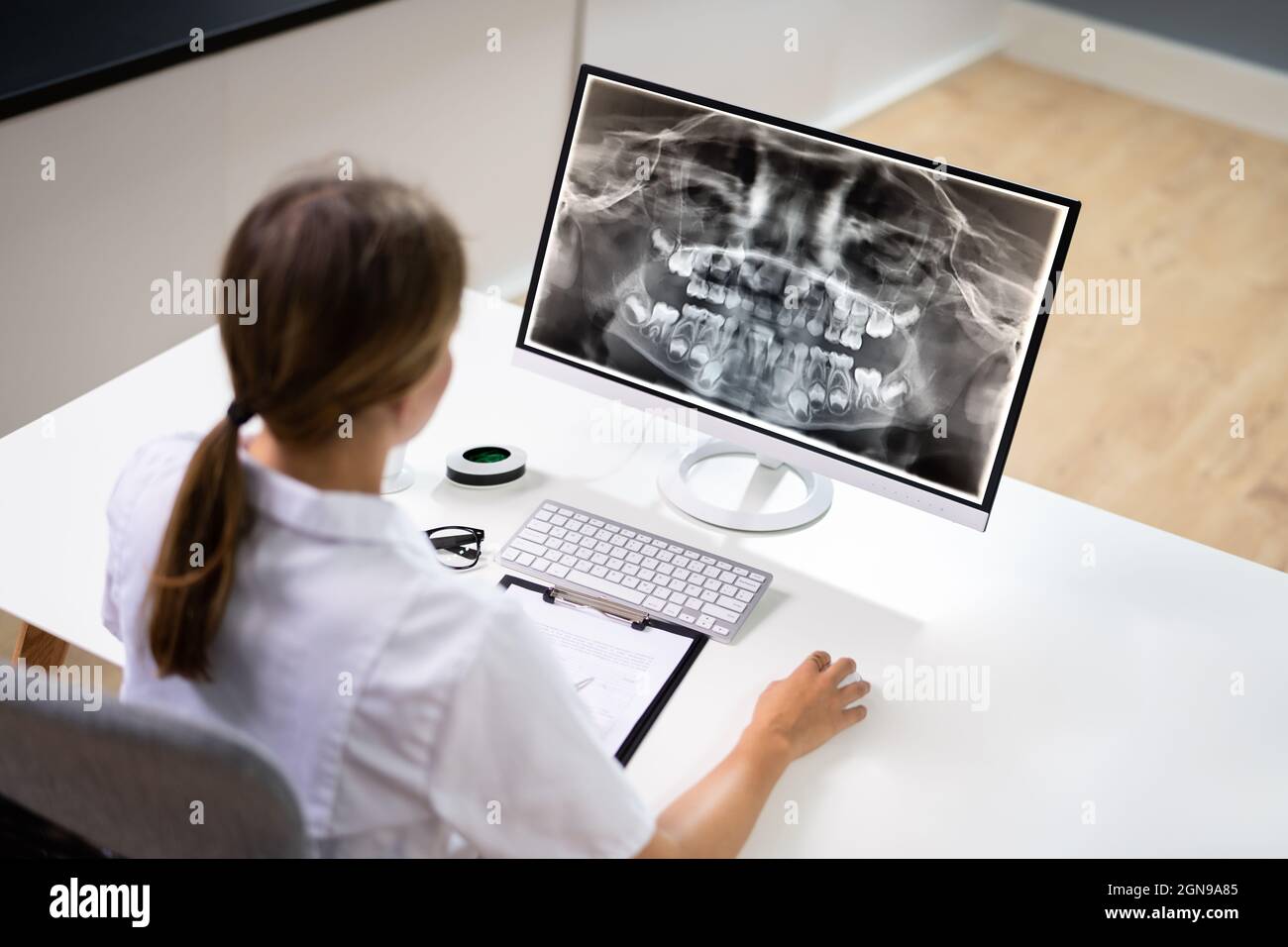 Radiologist Dentist Using X Ray Software On Desktop Computer Stock ...