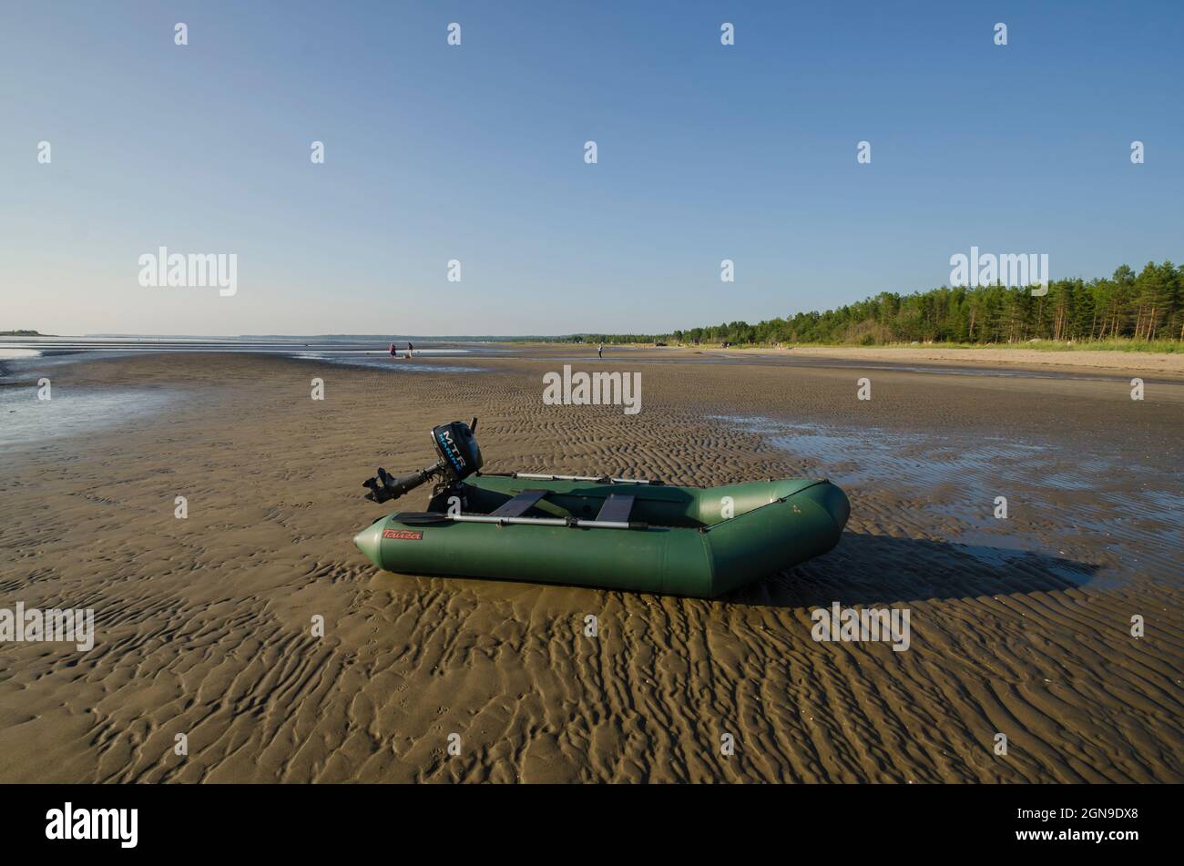 A rubber boat on a dry shore. Onega Bay of the White Sea Stock Photo ...