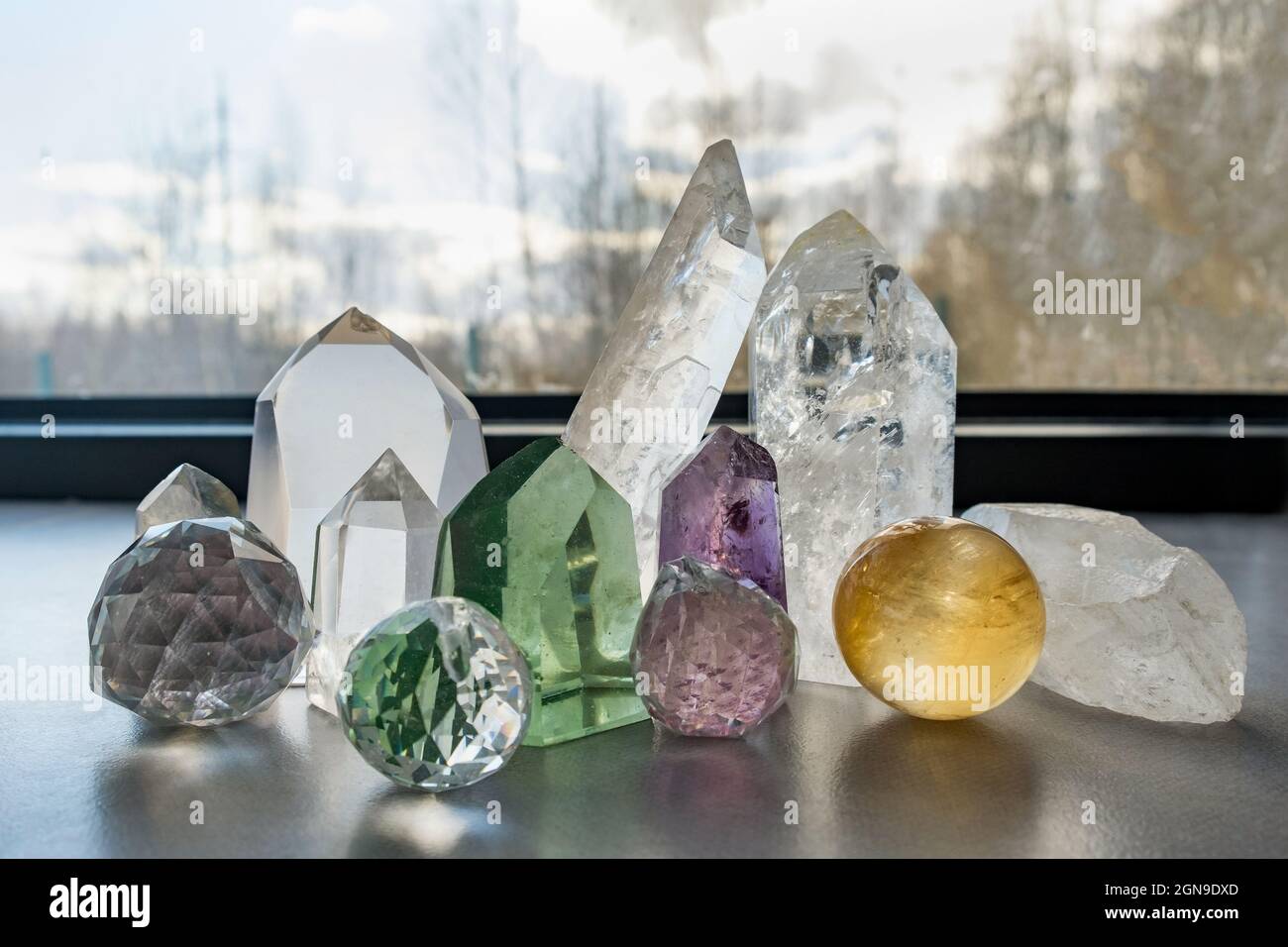 Closeup of spiritual healing crystals on a table against a window Stock ...