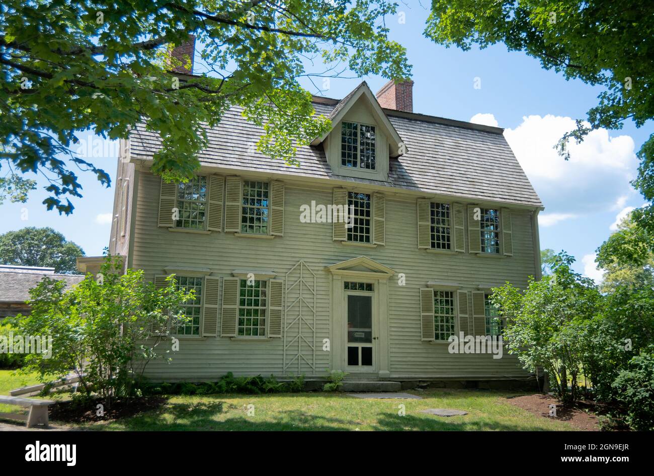 The historic Old Manse house on a sunny day with blue sky and clouds ...