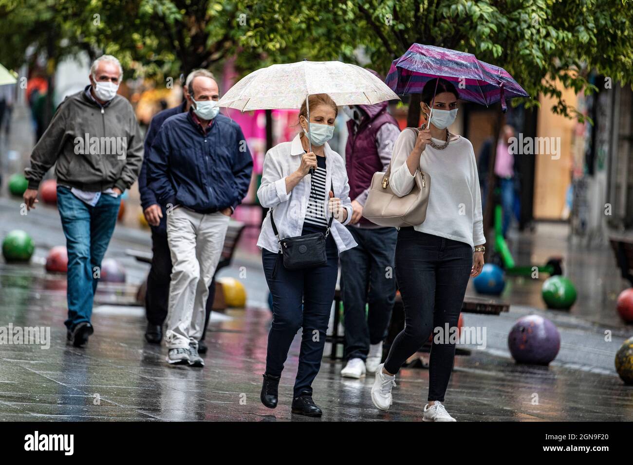People seen carrying umbrellas to protect themselves from the rain on ...