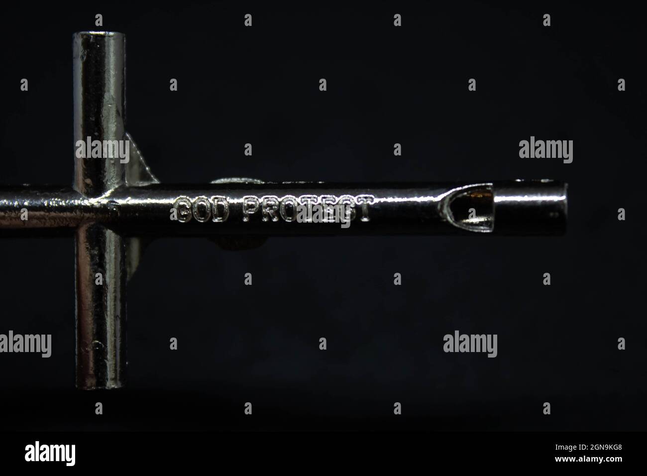 Silver cross. God protect written on it. Jesus served his life to save ...