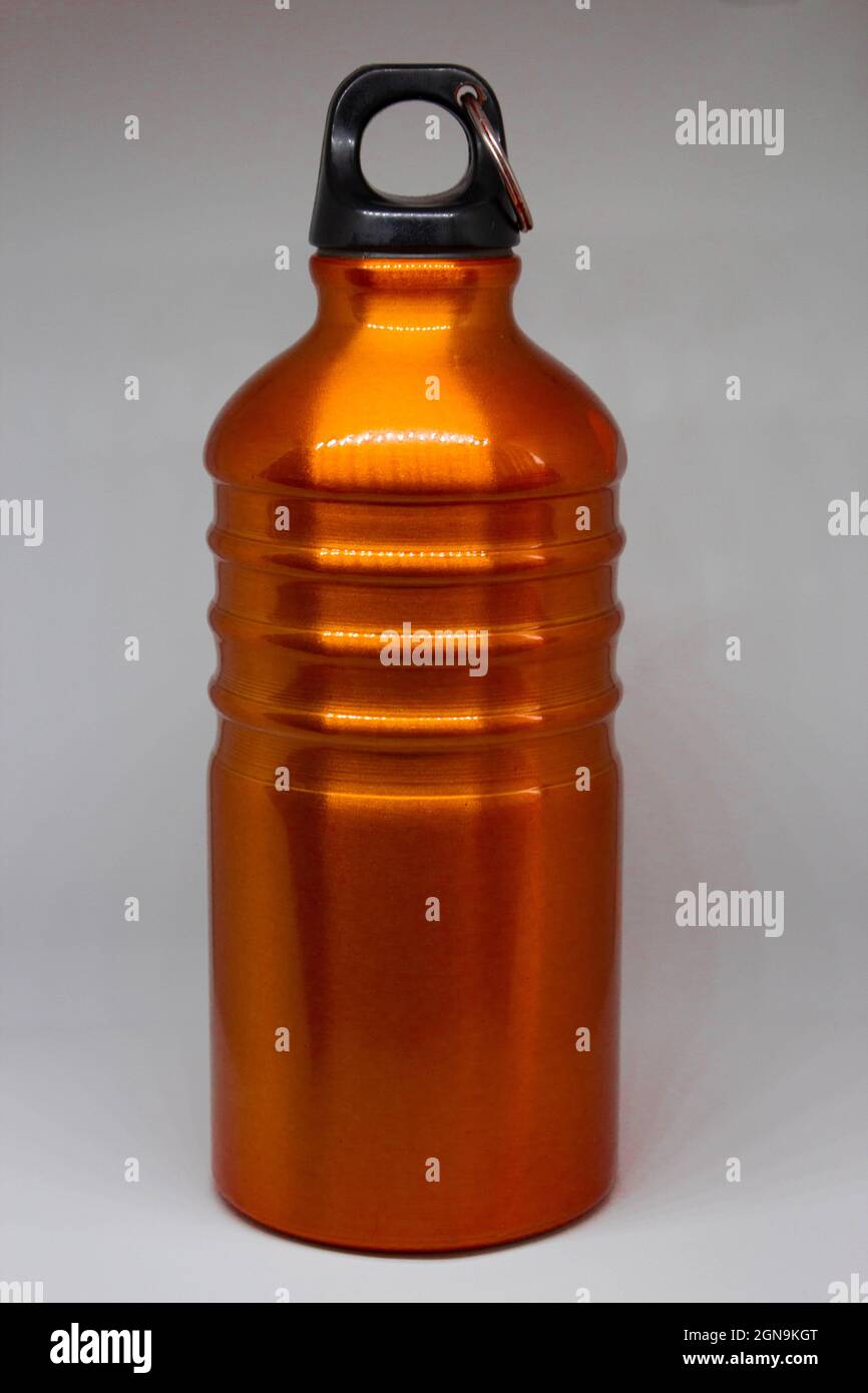 Orange and yellow flask on a white background. Thermos for campers ...