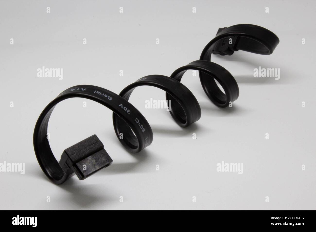 Red, black and orange SATA cable for connecting HDD or SSD to the ...