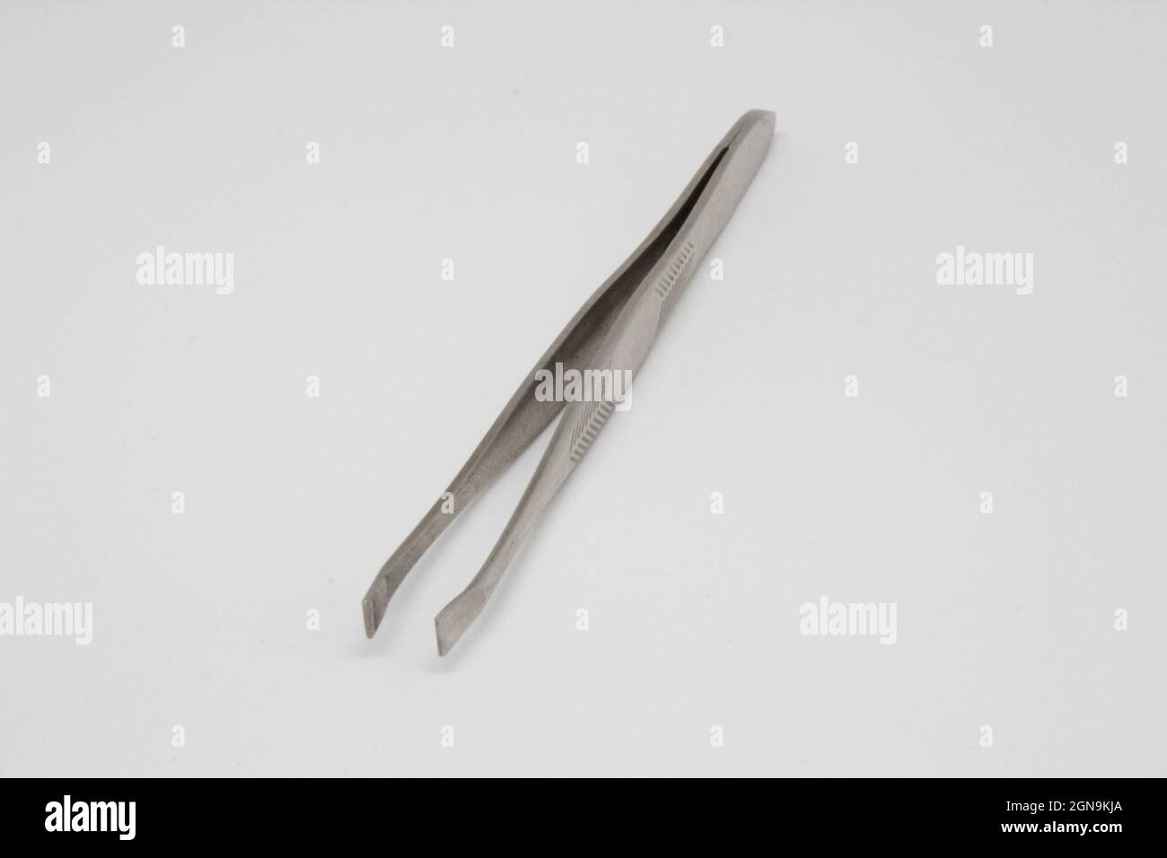 Tweezer (Thumb forceps) in different compositions and directions. Hair ...
