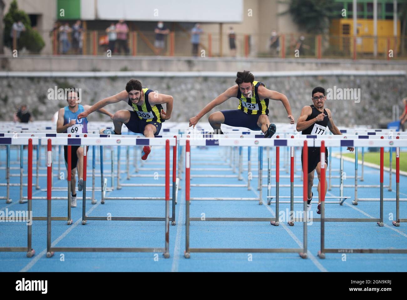 ISTANBUL, TURKEY - JUNE 23, 2021: Athletes running 100 metres hurdles ...