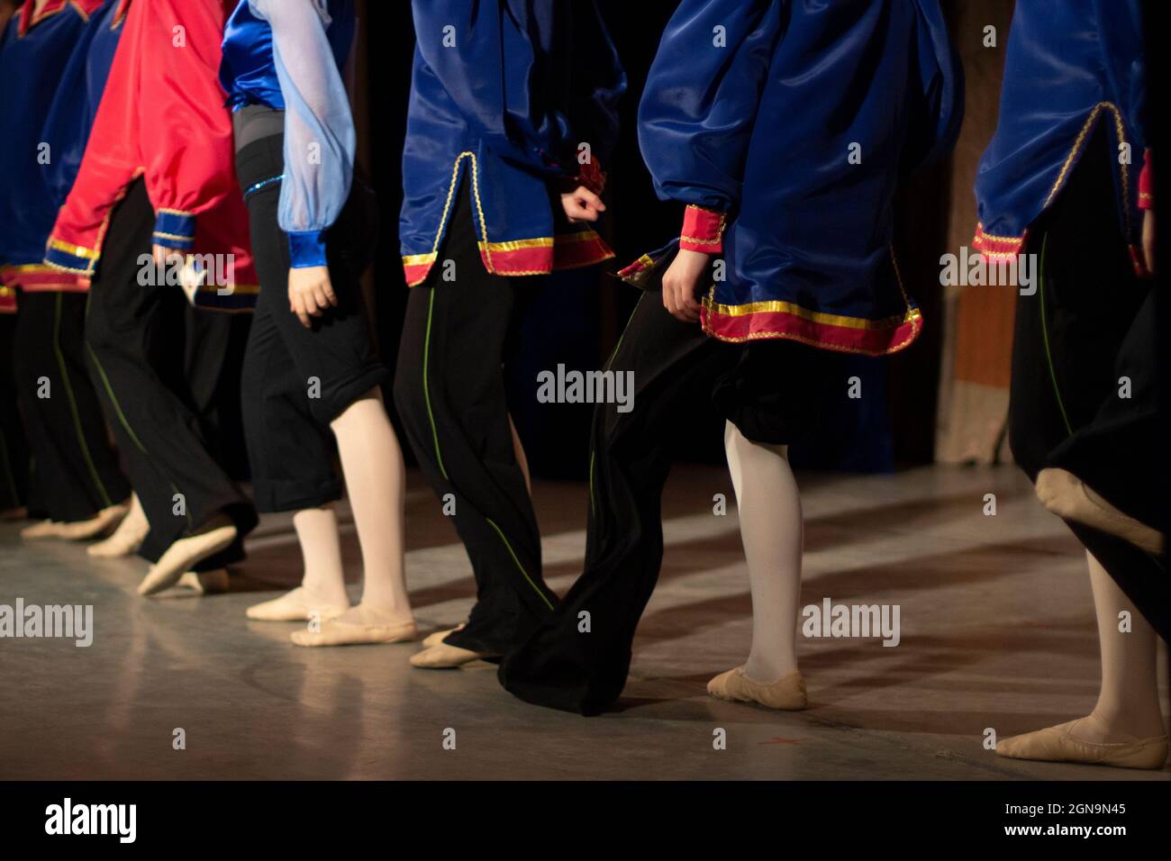 Children perform with dance on stage. Dance lessons. A lot of kids in ...