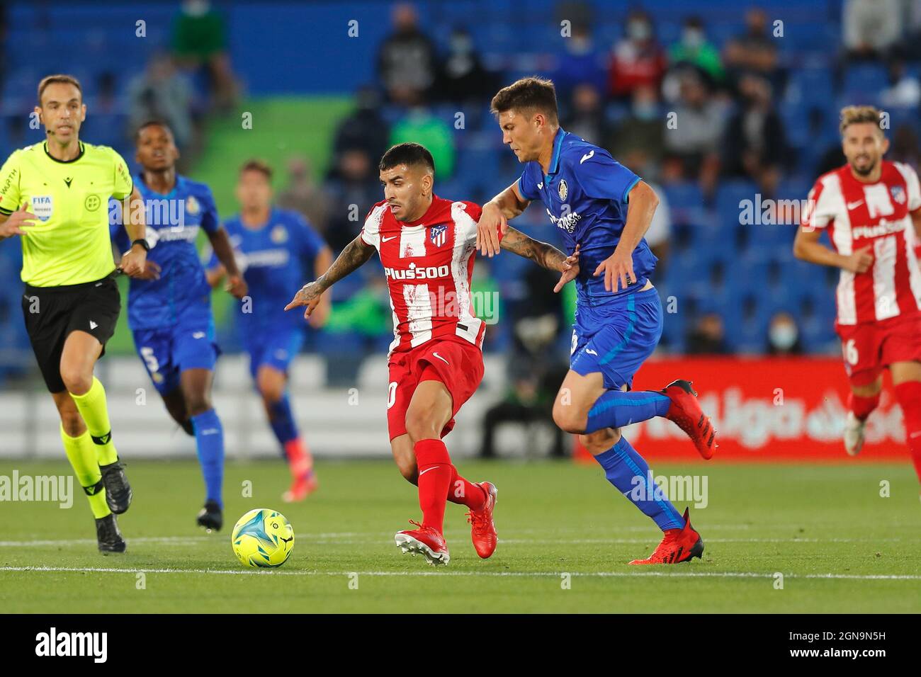 Getafe, Spain. 21st Sep, 2021. (L-R) Angel Correa (Atletico), Jorge ...