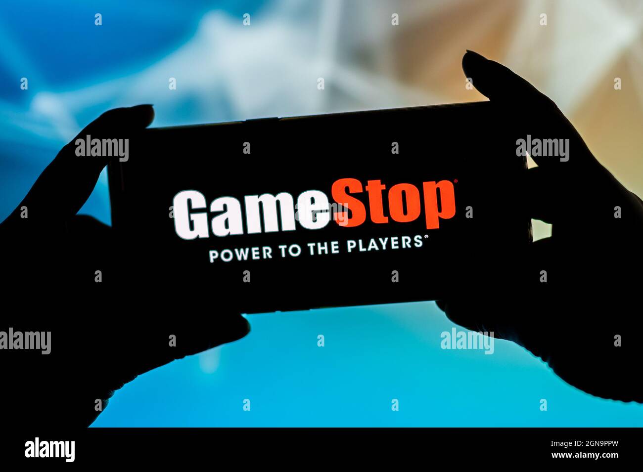 In this photo illustration a Game Stop logo seen displayed on a ...