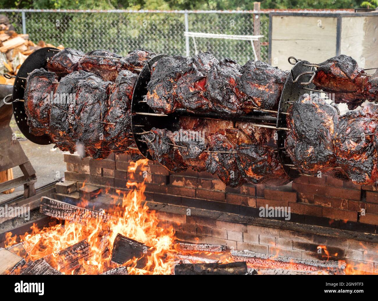Eight hundred pounds of beef skewered on a custom made motor driven ...