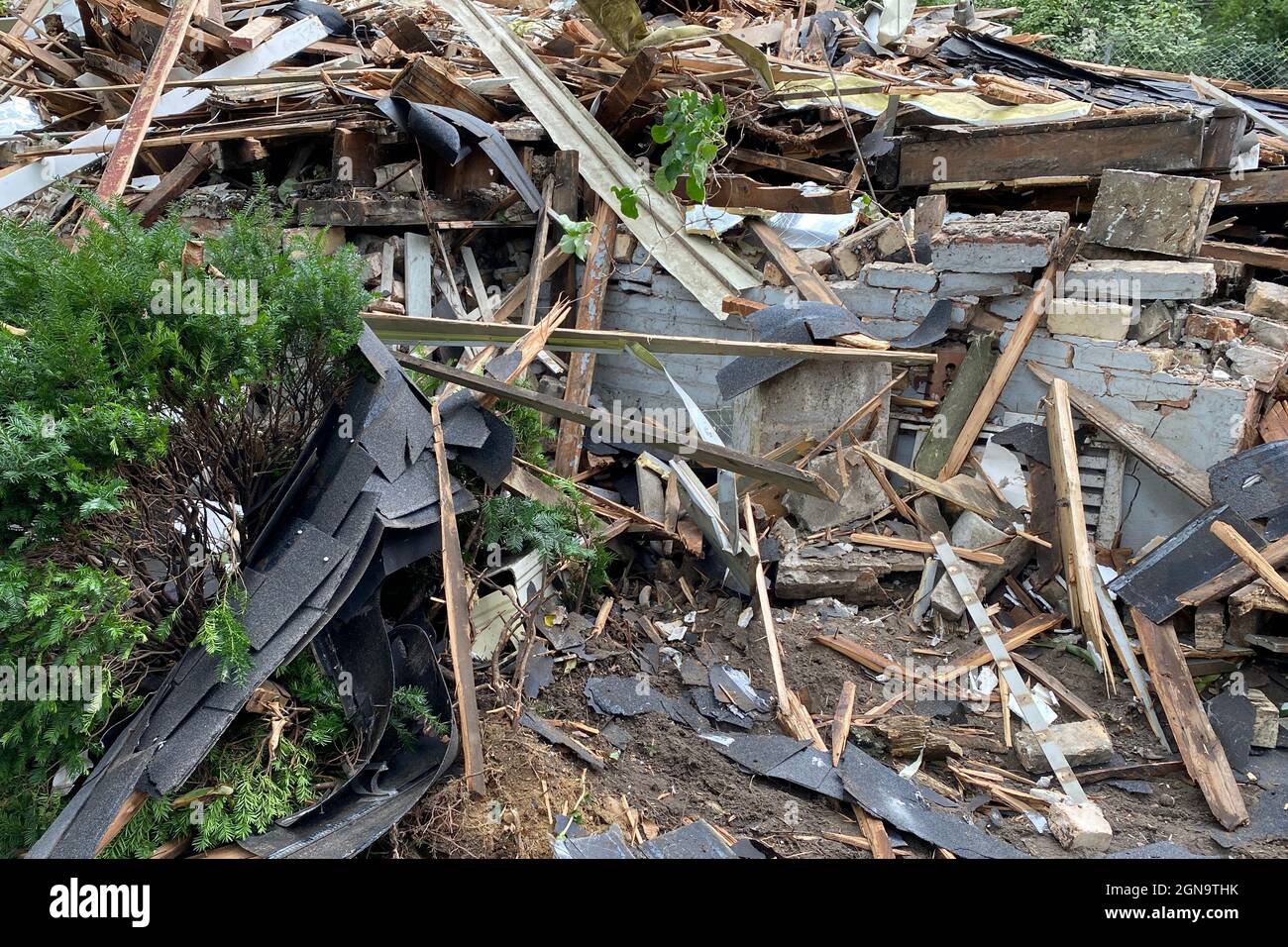 Debris piled up after the demolition of a house Stock Photo - Alamy