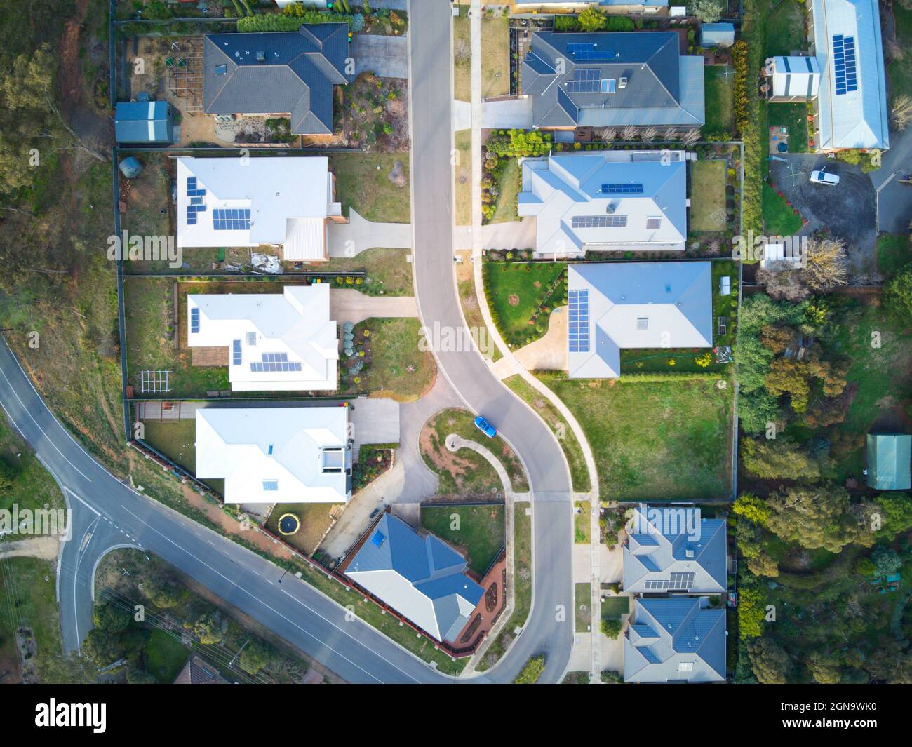 Aerial view of residential street, homes and gardens in a suburban ...