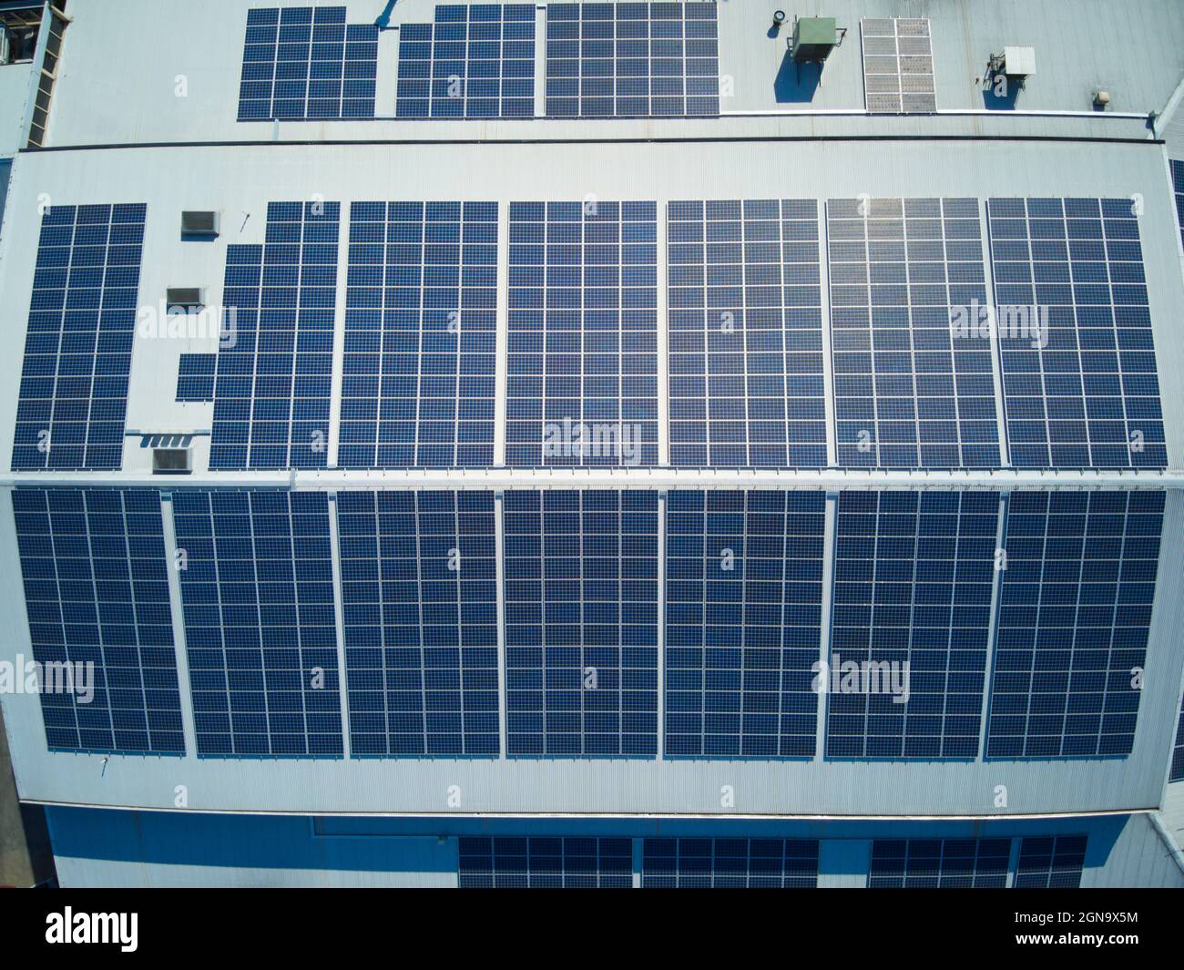 Building solar panels on roof of supermarket in Castlemaine, Australia ...