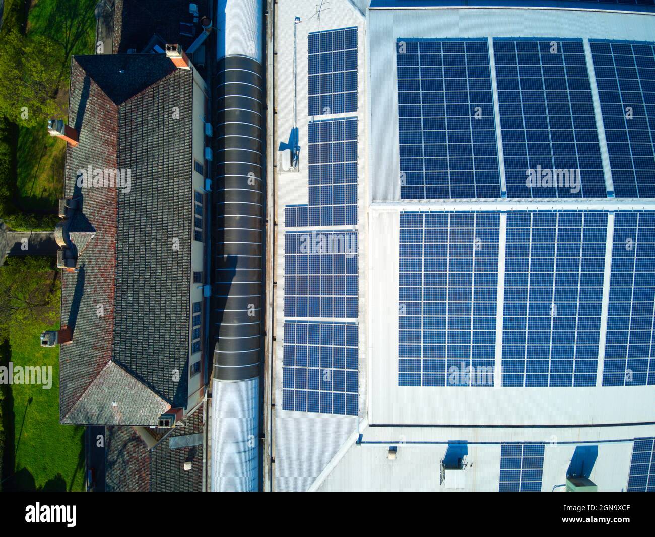 Building solar panels on roof of supermarket in Castlemaine, Australia ...