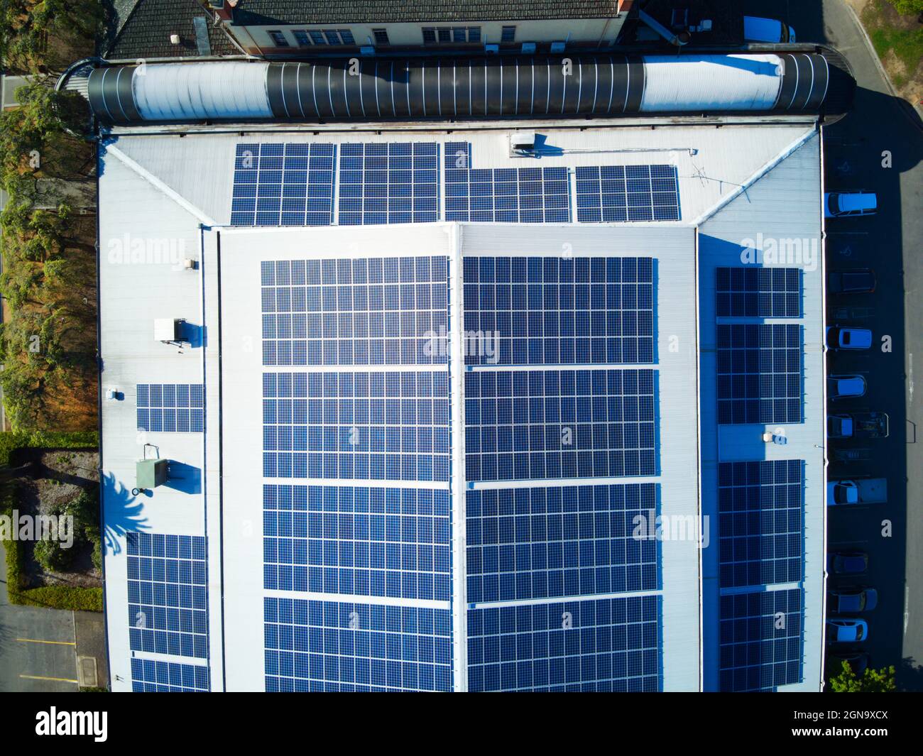 Building solar panels on roof of supermarket in Castlemaine, Australia ...