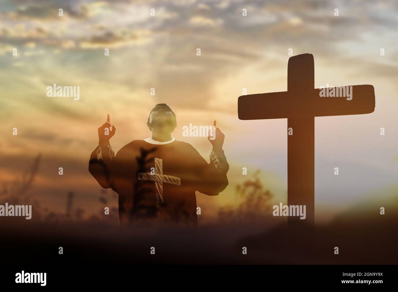 Silhouette of man raising hands worship and praise God. Christian ...