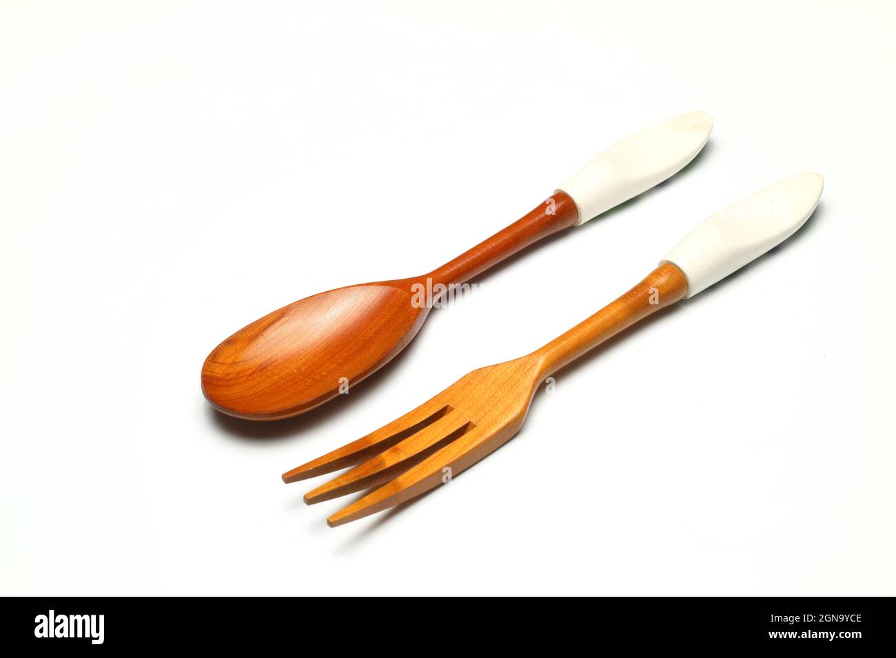 Top view of wooden spoon and fork isolated on white background with ...