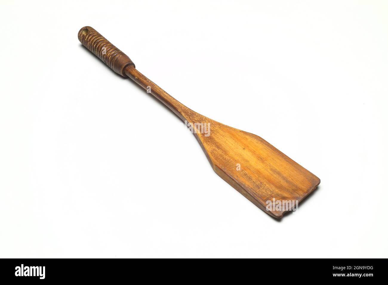 Old wood spatula for cooking on white background Stock Photo - Alamy