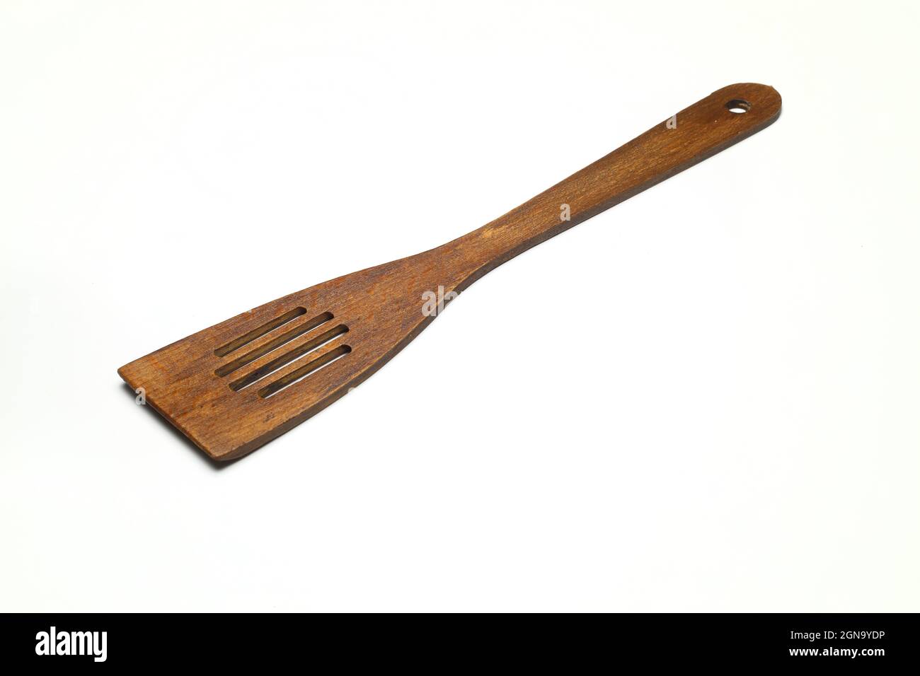 Old wood spatula for cooking on white background Stock Photo - Alamy