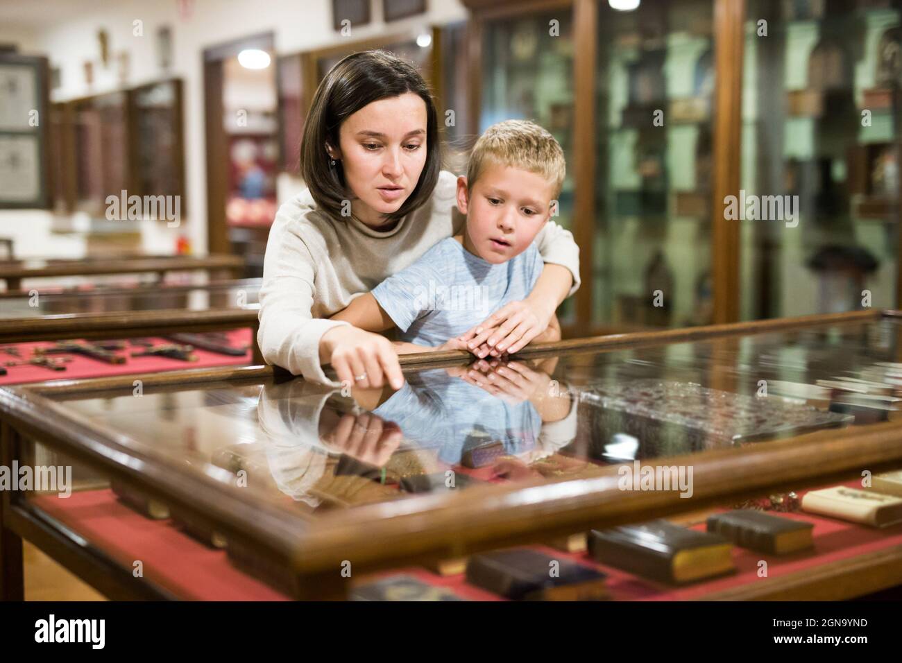 Woman and boy exploring artworks in museum Stock Photo - Alamy