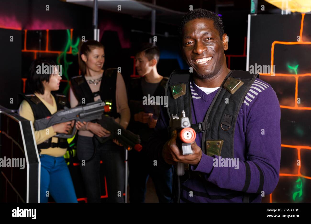 African laser tag player with gun ready for game Stock Photo - Alamy
