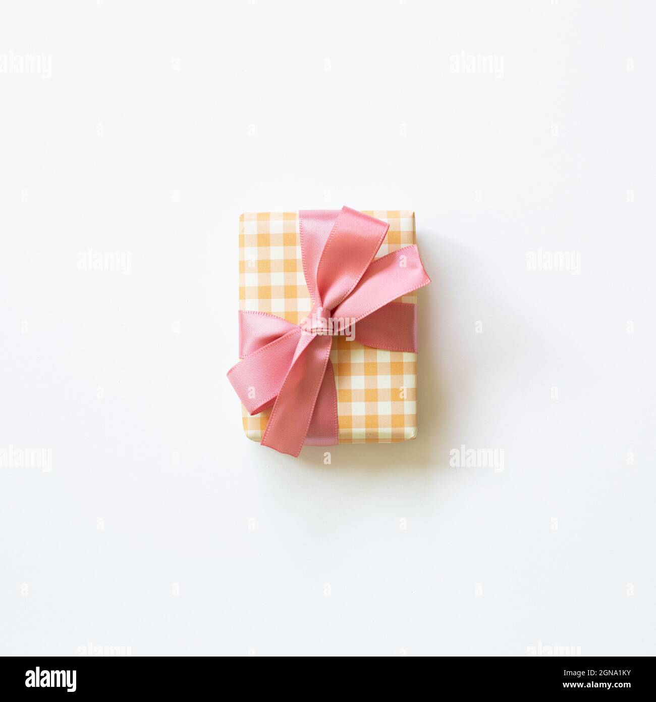 Yellow check pattern gift box isolated on white background. top view ...