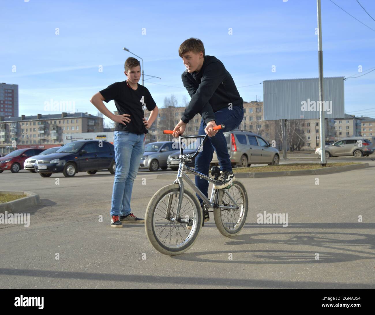 Kovrov, Russia. 9 April 2017. Teen on BMX bike performs a trick near the shopping center Rus ...