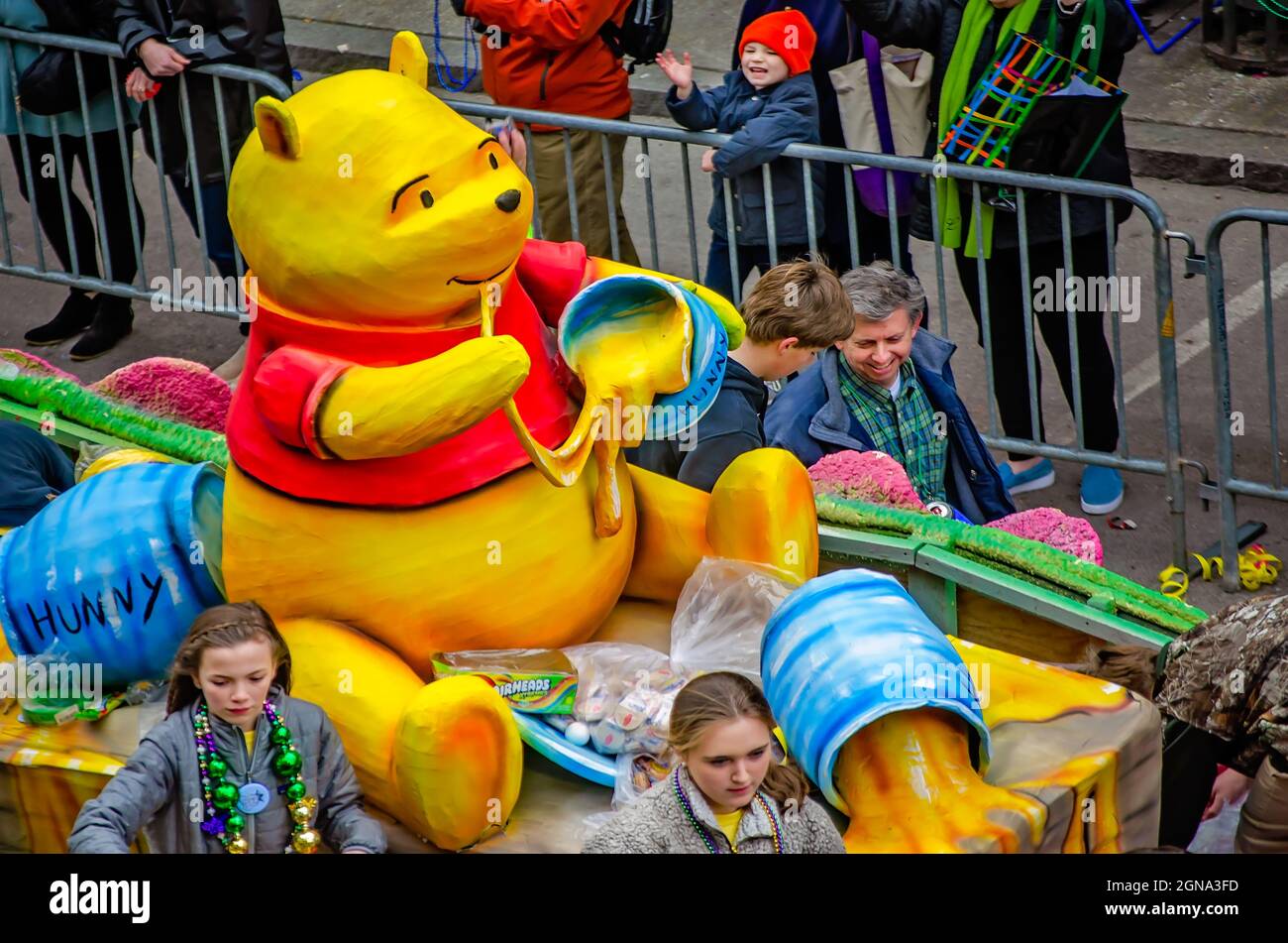 A Mardi Gras float featuring Winnie the Pooh travels down Royal Street ...
