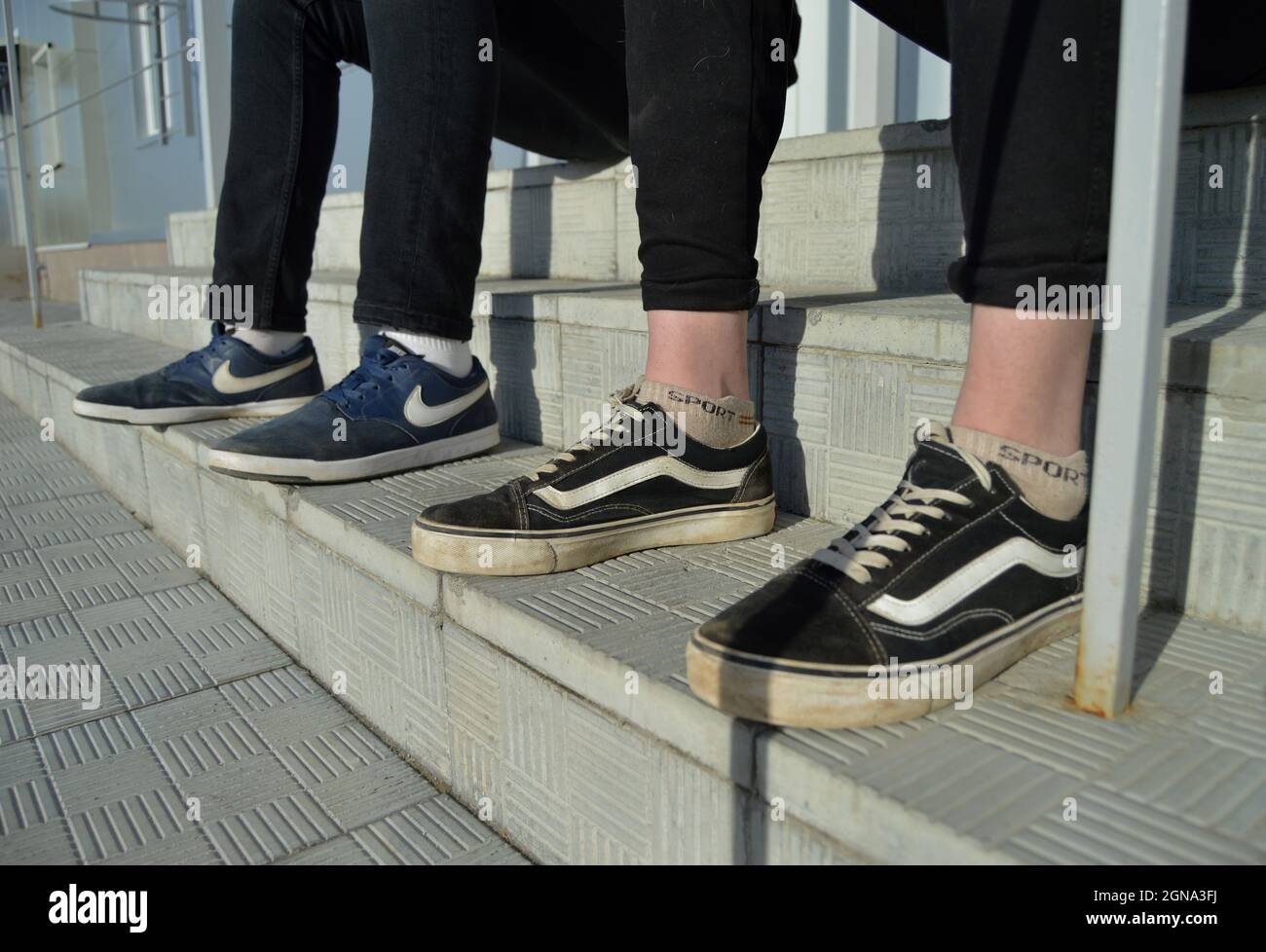 Kovrov, Russia. 9 April 2017. Teens who ride on BMX bikes resting on steps shopping center Rus ...