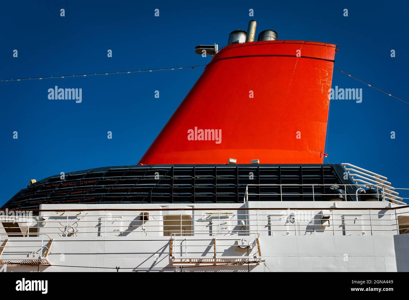 The blue sky behind the smoke stack of a cruise ship docked at Yokohama ...