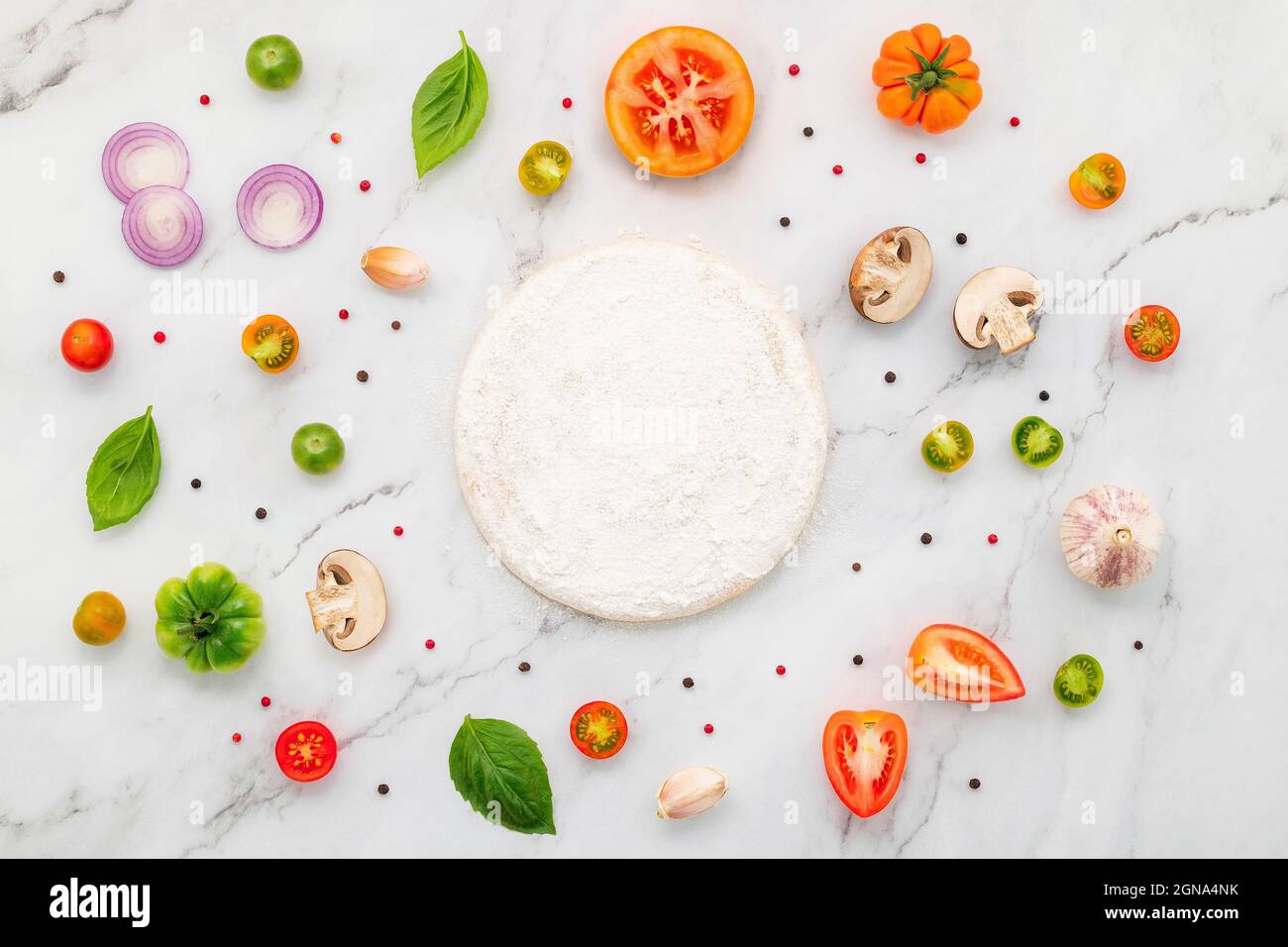 The ingredients for homemade pizza set up on white marble background ...