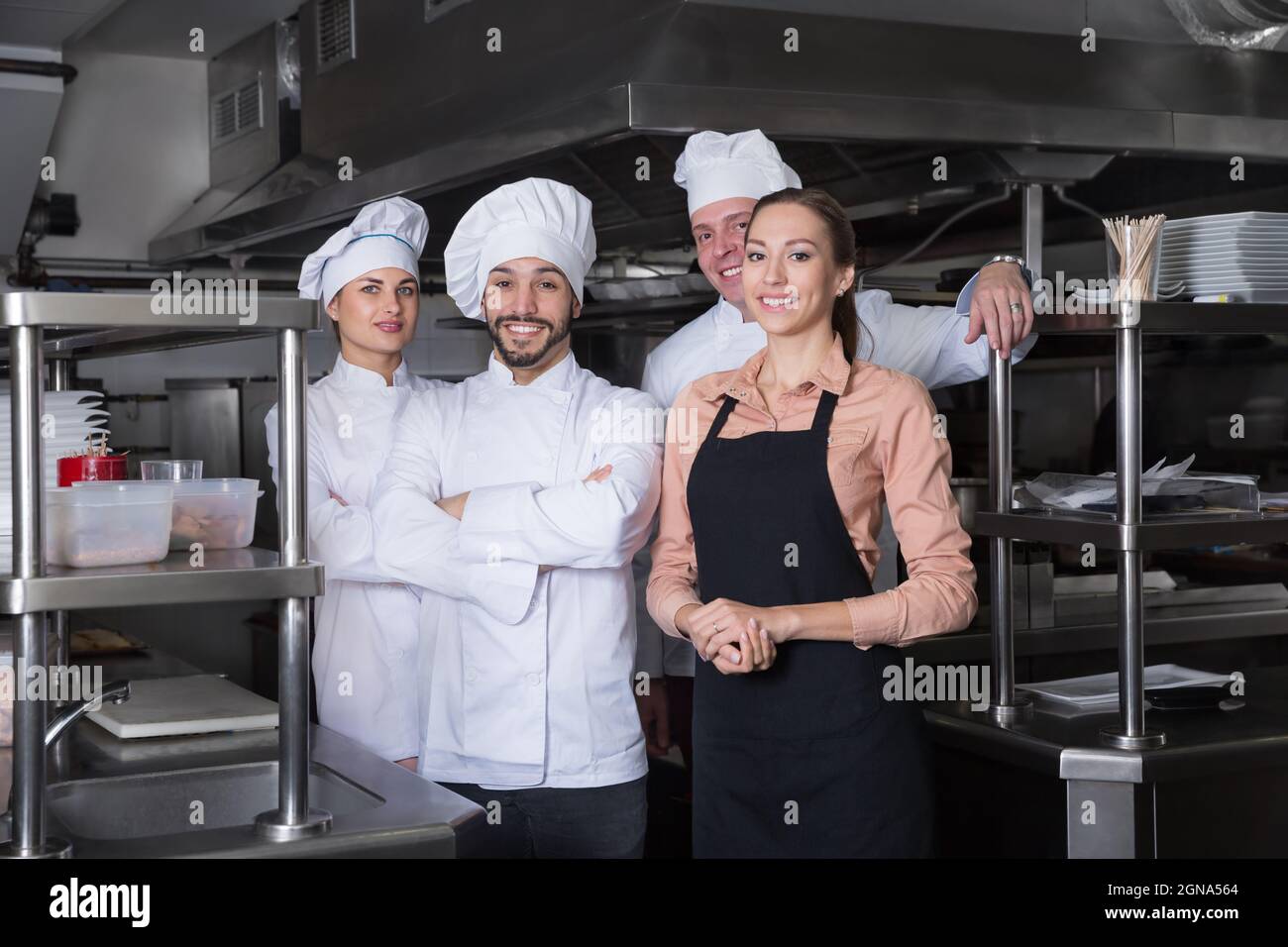 Team of restaurant staff posing together Stock Photo - Alamy