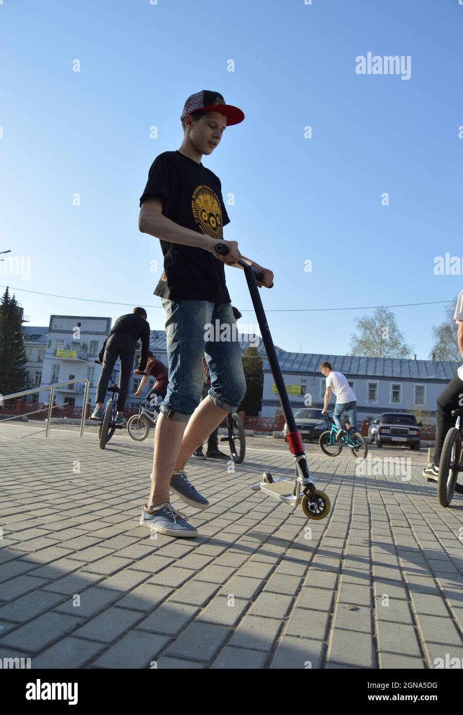 Kovrov, Russia. 30 April 2017. Teens on scooter and BMX bikes near the shopping center Kovrov ...