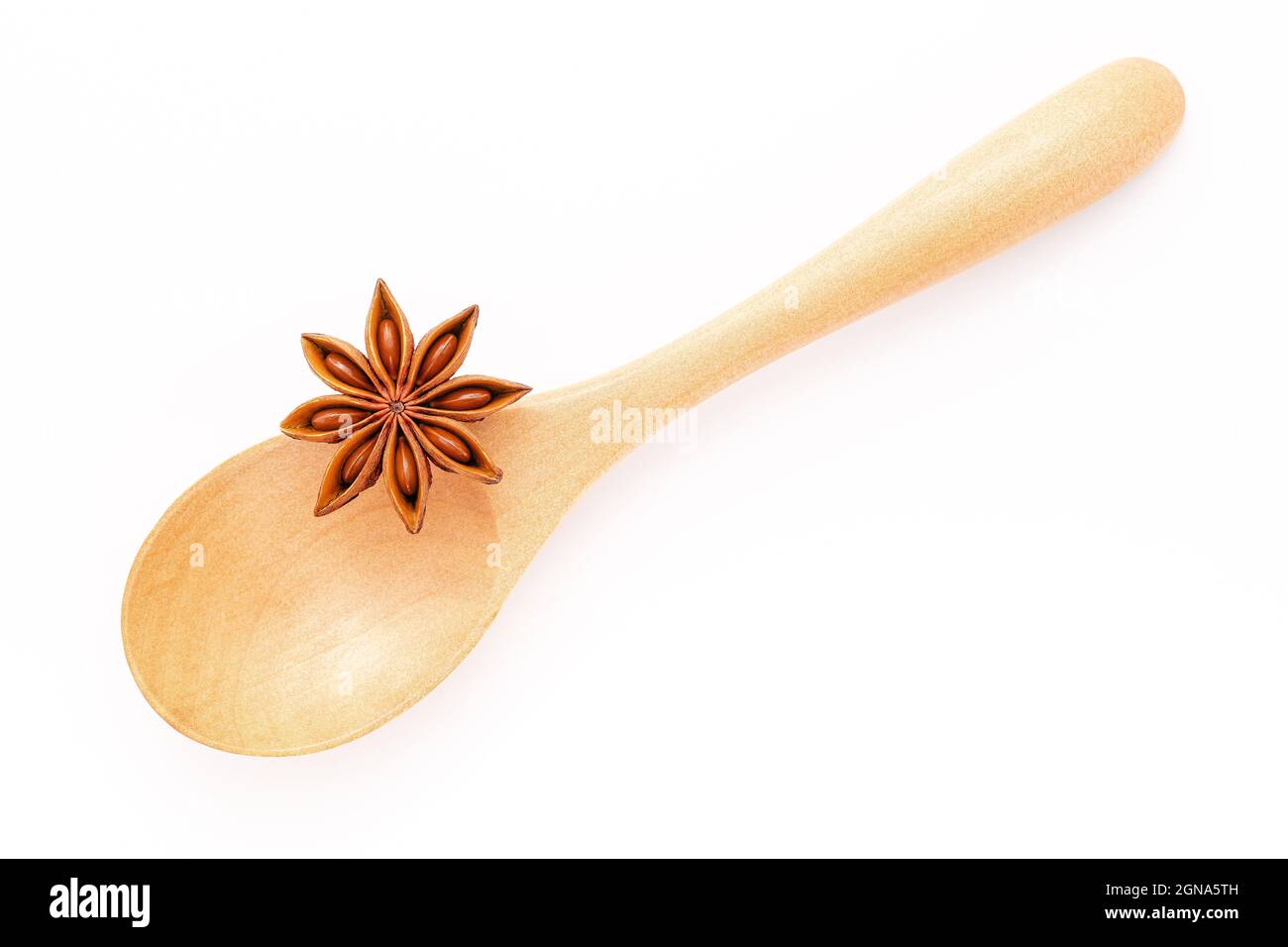 Close up chinese star anise in wooden spoon isolate on white background ...