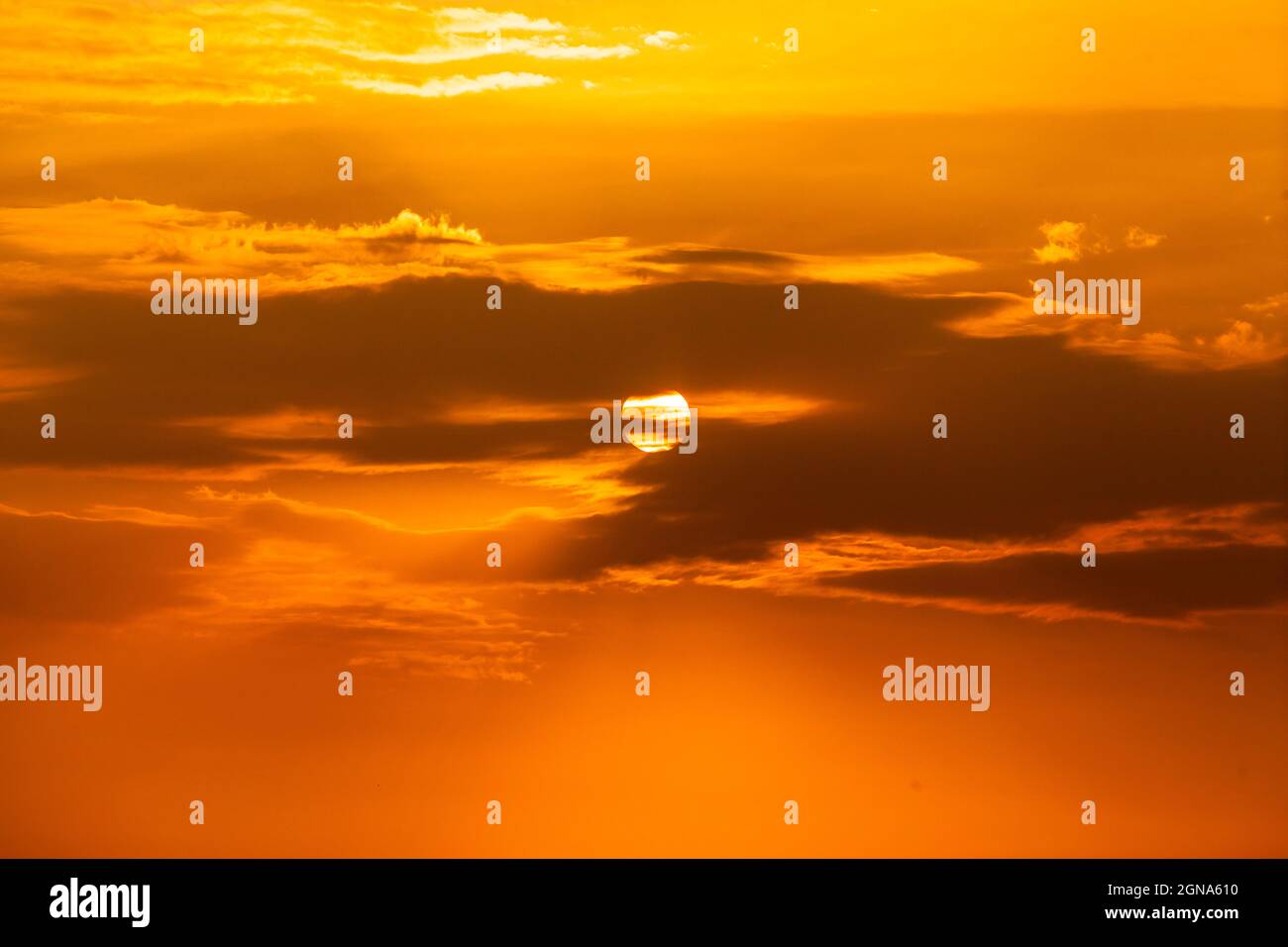 Telephoto photo of yellow orange sunset sunrise, clouds, sky golden ...
