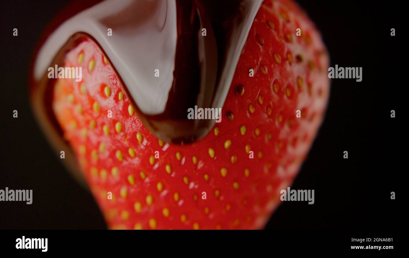 Chocolate driping on strawberry close up macro liquid drip sweet ...
